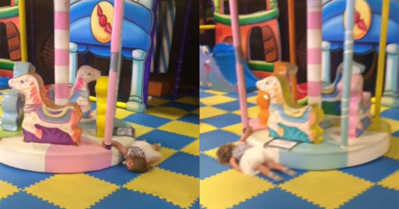 Child has an unusual way of riding the merry go round - The Poke